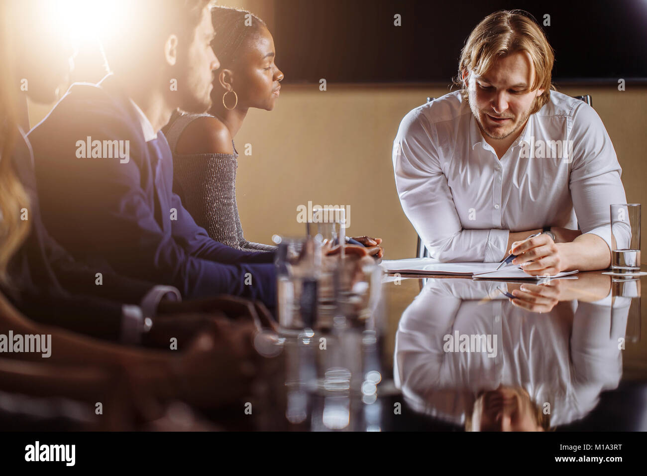 Team leader talking with coworkers in modern office Stock Photo - Alamy