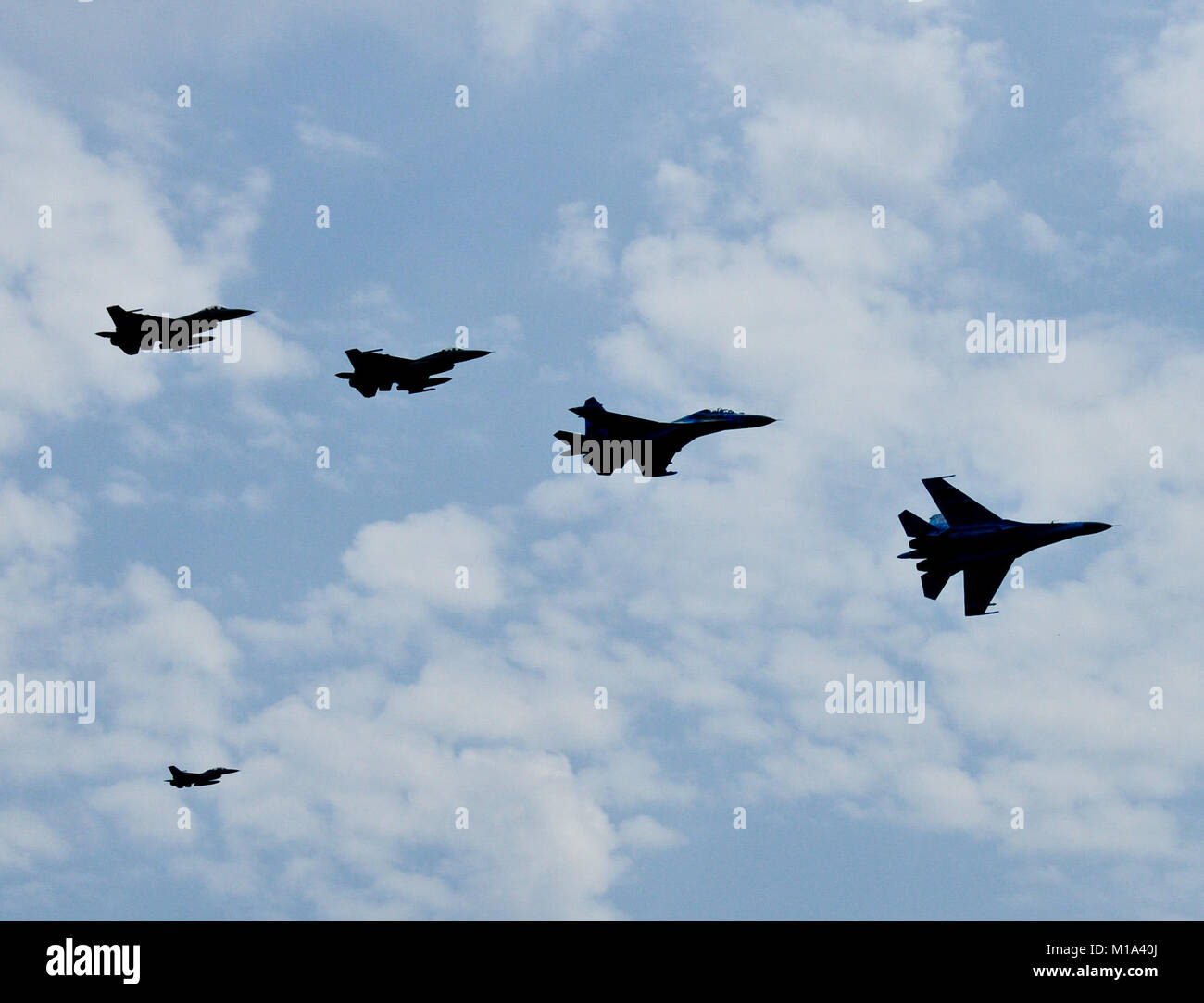 Two Air National Guard F-16s fly in formation with 2 Ukraine SU-27s ...