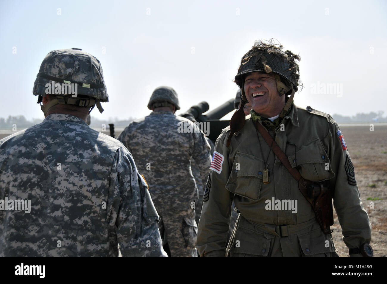 111023-Z-XQ016-005 A man dressed as a WWII veteran chats with members ...