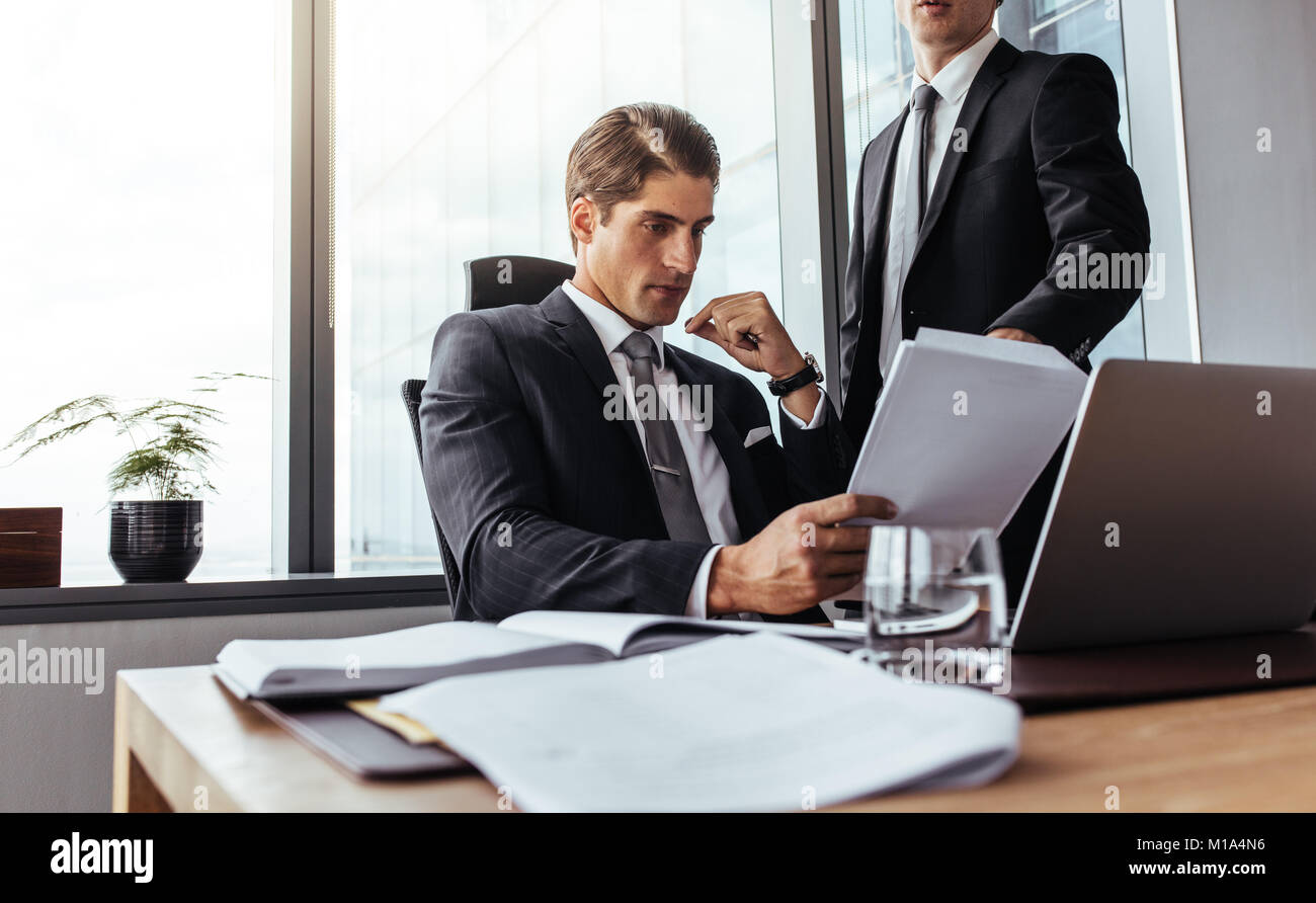 Two men reading paper hi-res stock photography and images - Alamy