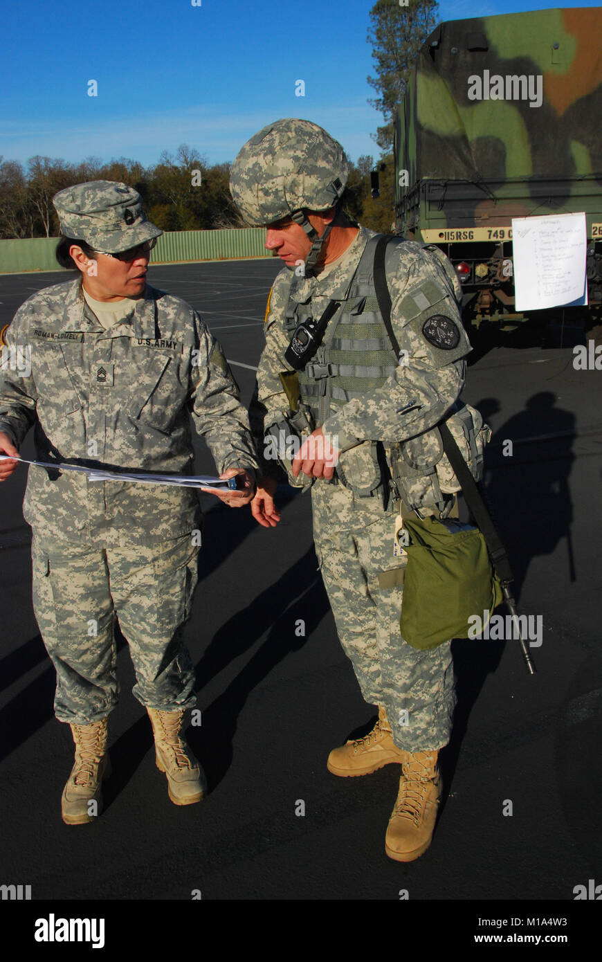 California Army National Guard Master Sgt. April Roman-Lomeli, left, an ...