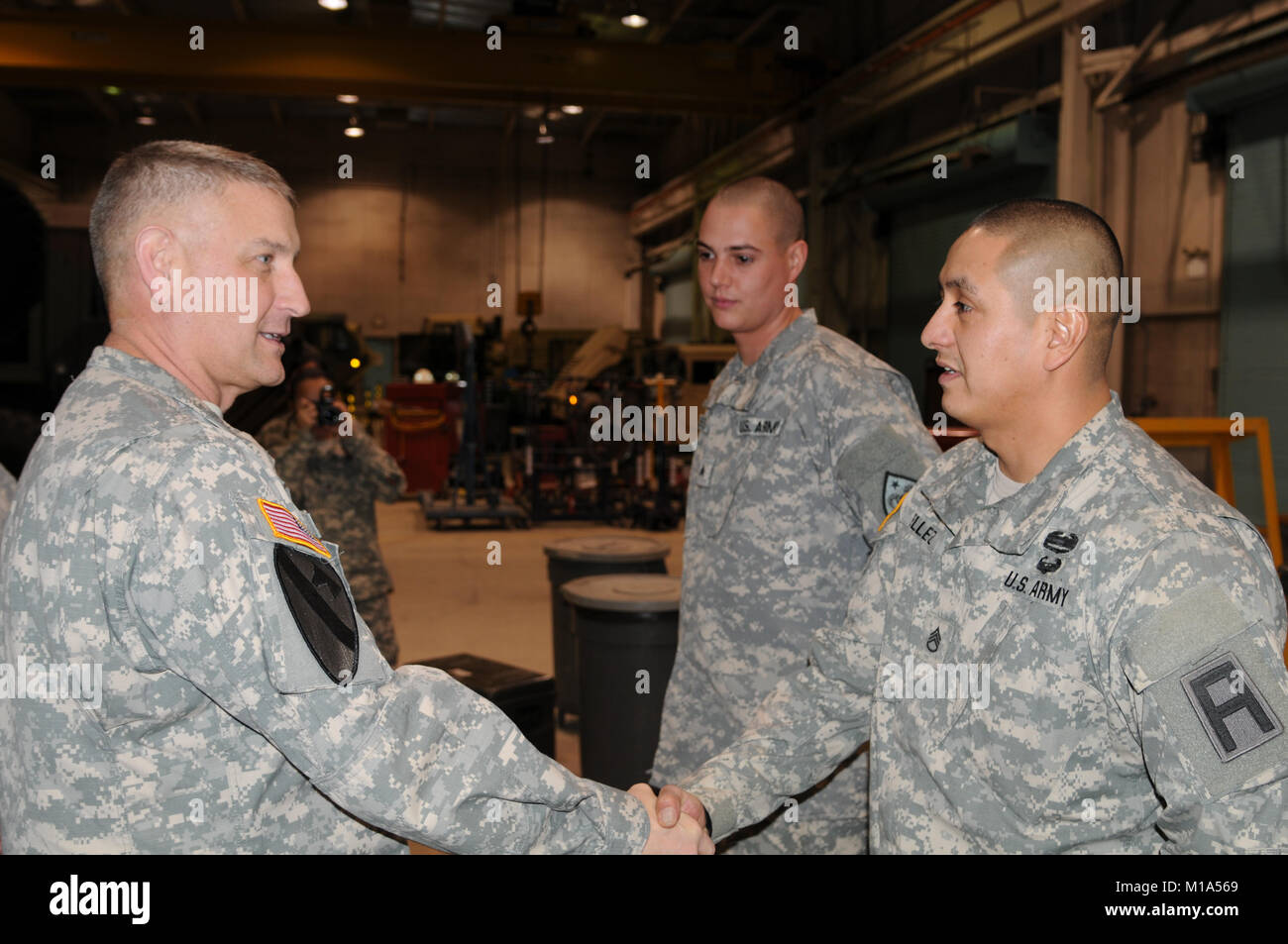 Sgt. Maj. of the Army Raymond F. Chandler III shakes hands with Staff ...