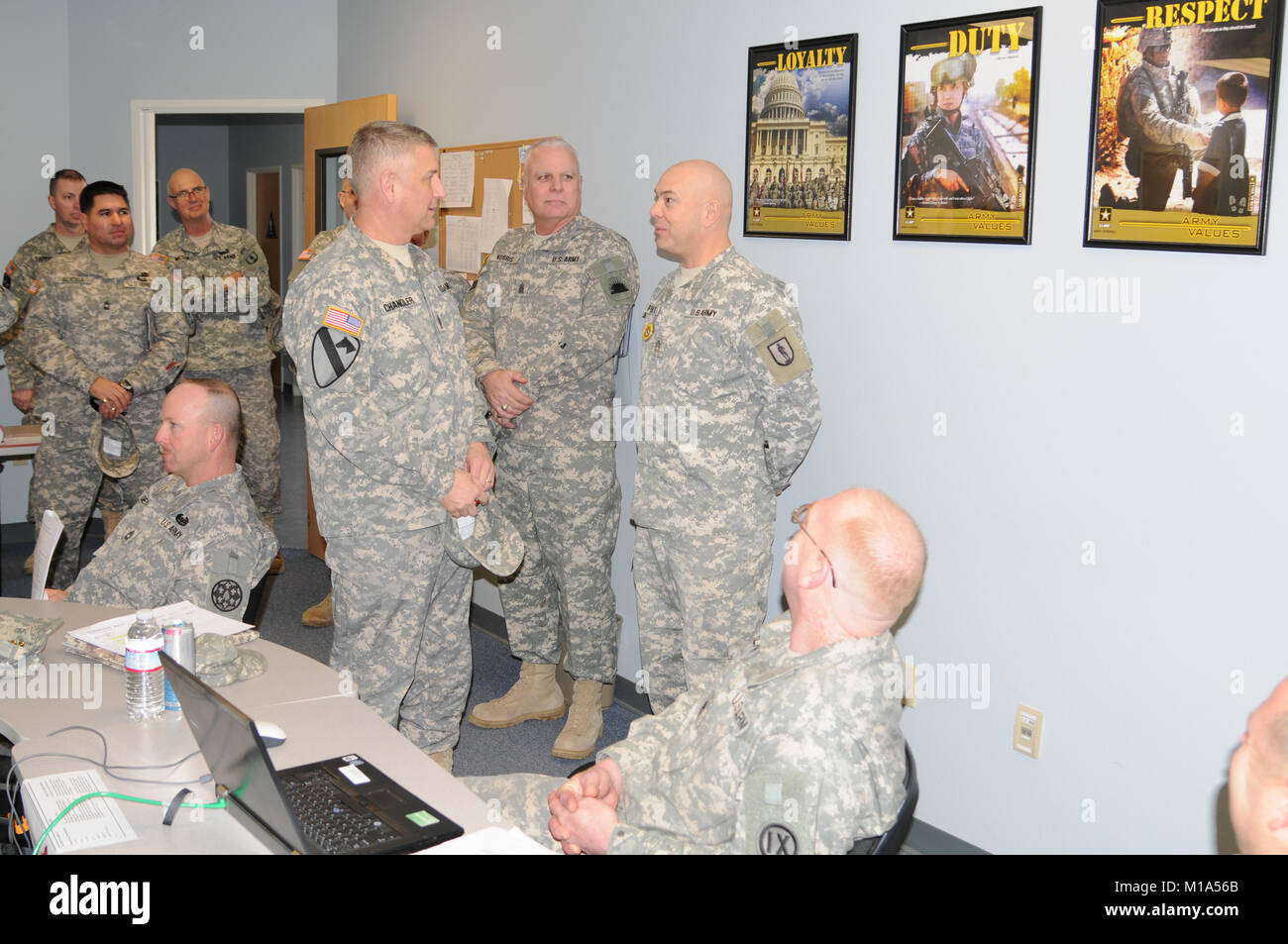 Sgt. Maj. of the Army Raymond F. Chandler III speaks with Sgt. 1st ...