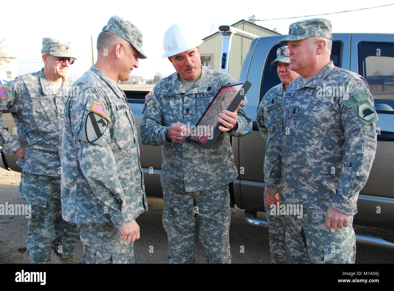 Command Sgt. Maj. Joseph Menard, white hat, explained the purpose of ...