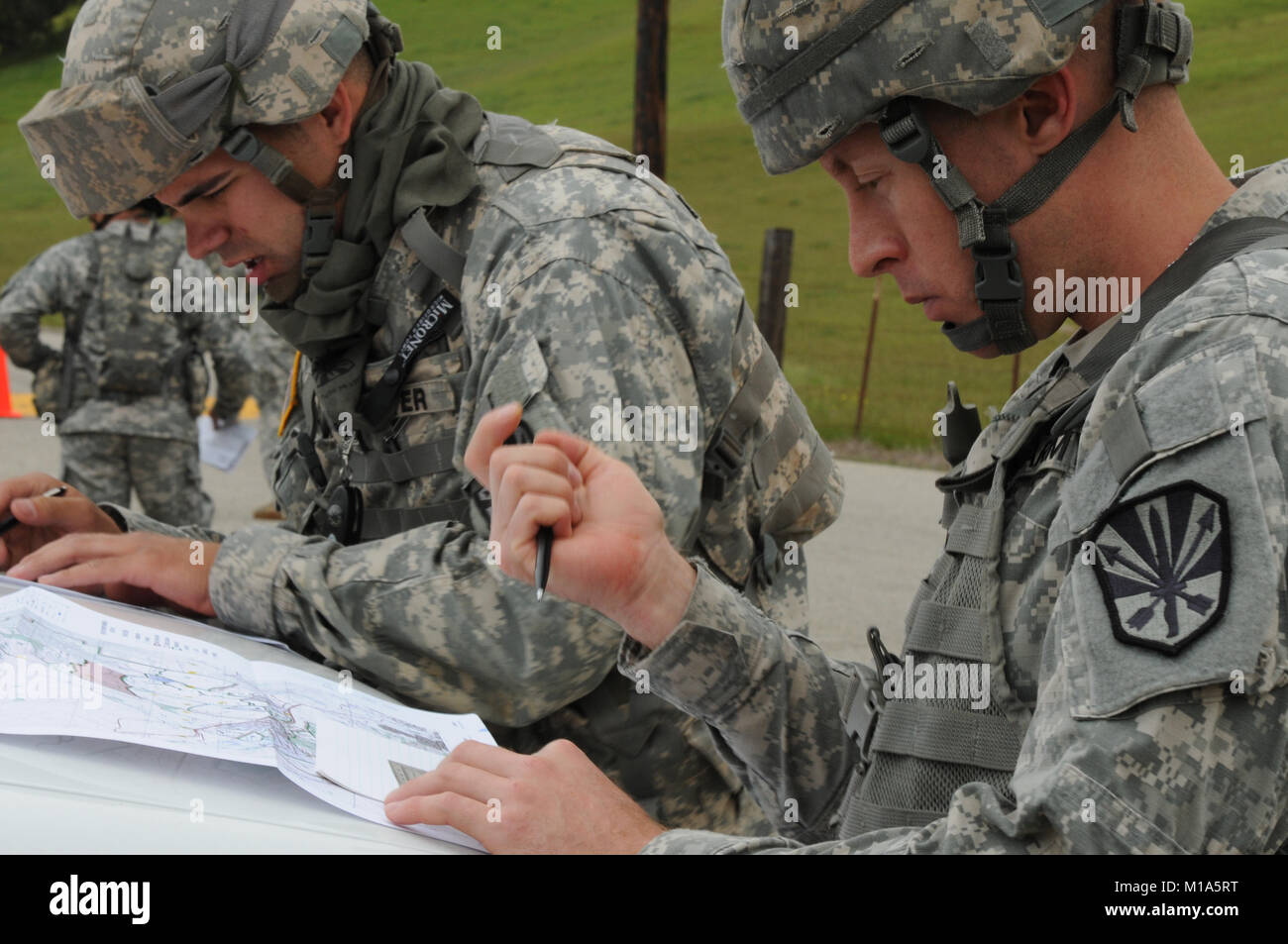 Spc. Benjamin Mason (front), a military police with Arizona Army ...