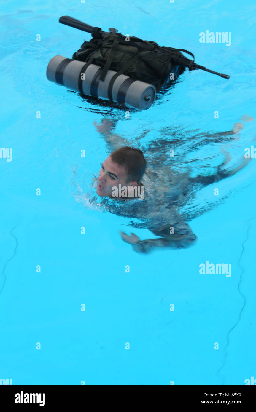 Spc. Julian Batz, Nevada, swims with a floating ruck sack during the ...