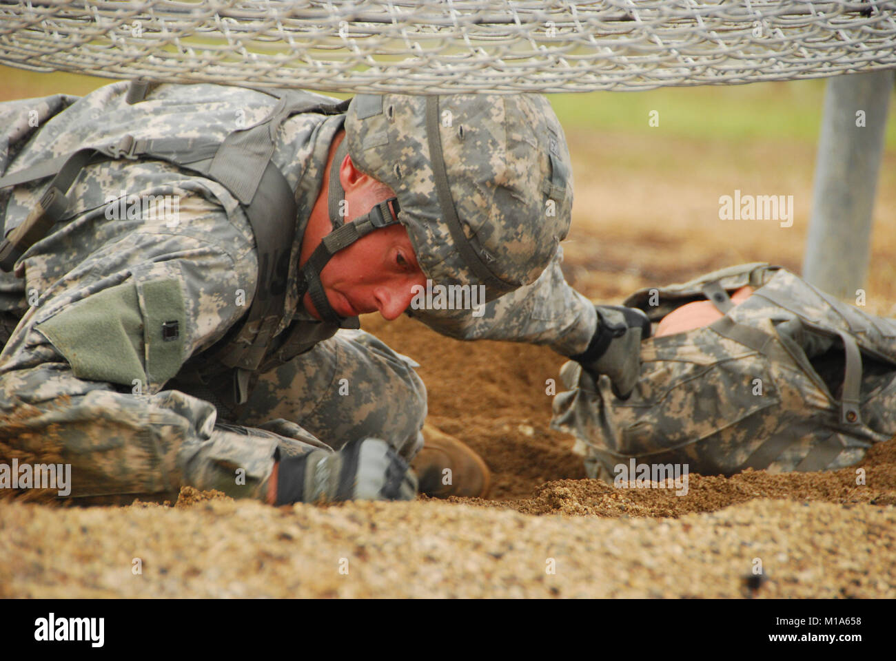 Spc. Benjamin Mason, Arizona Army National Guard, drags a casualty ...