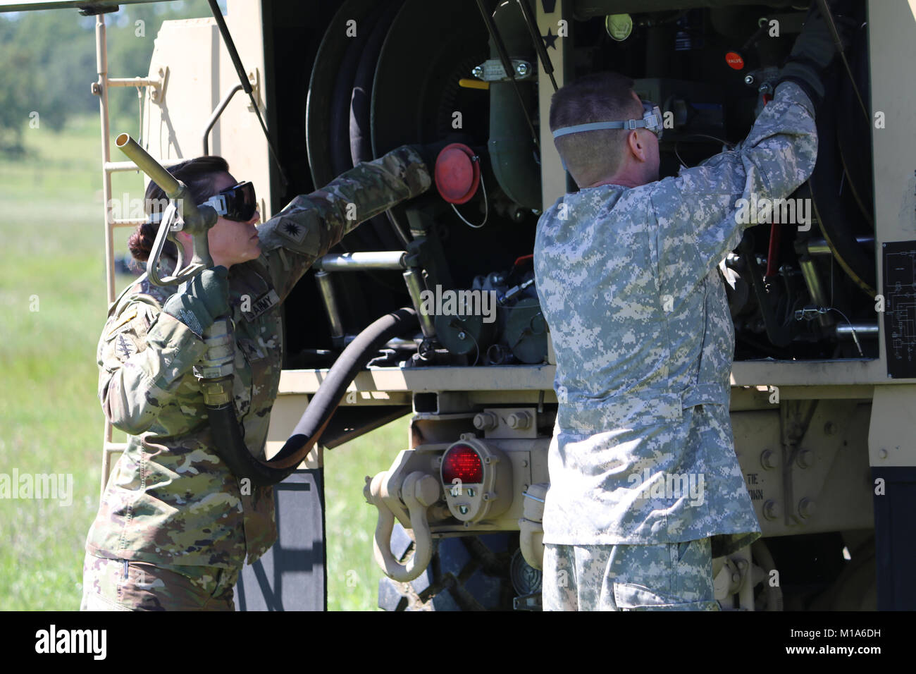 Sgt. Barbara Kizer and Sgt. Thomas Sneed, fuelers with 1-168th Task ...