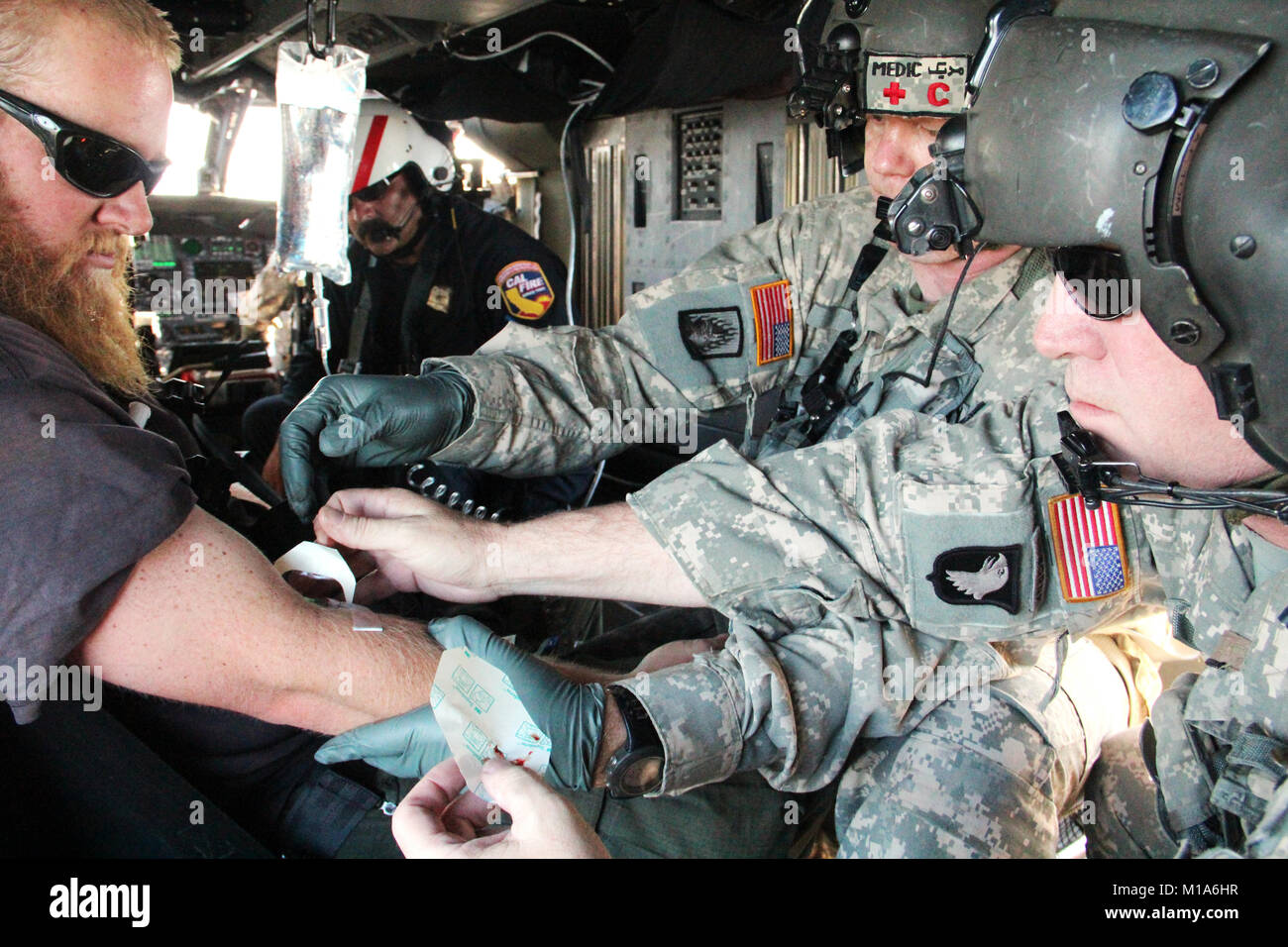 Soldiers from the California Army National Guard prepare a intravenous ...