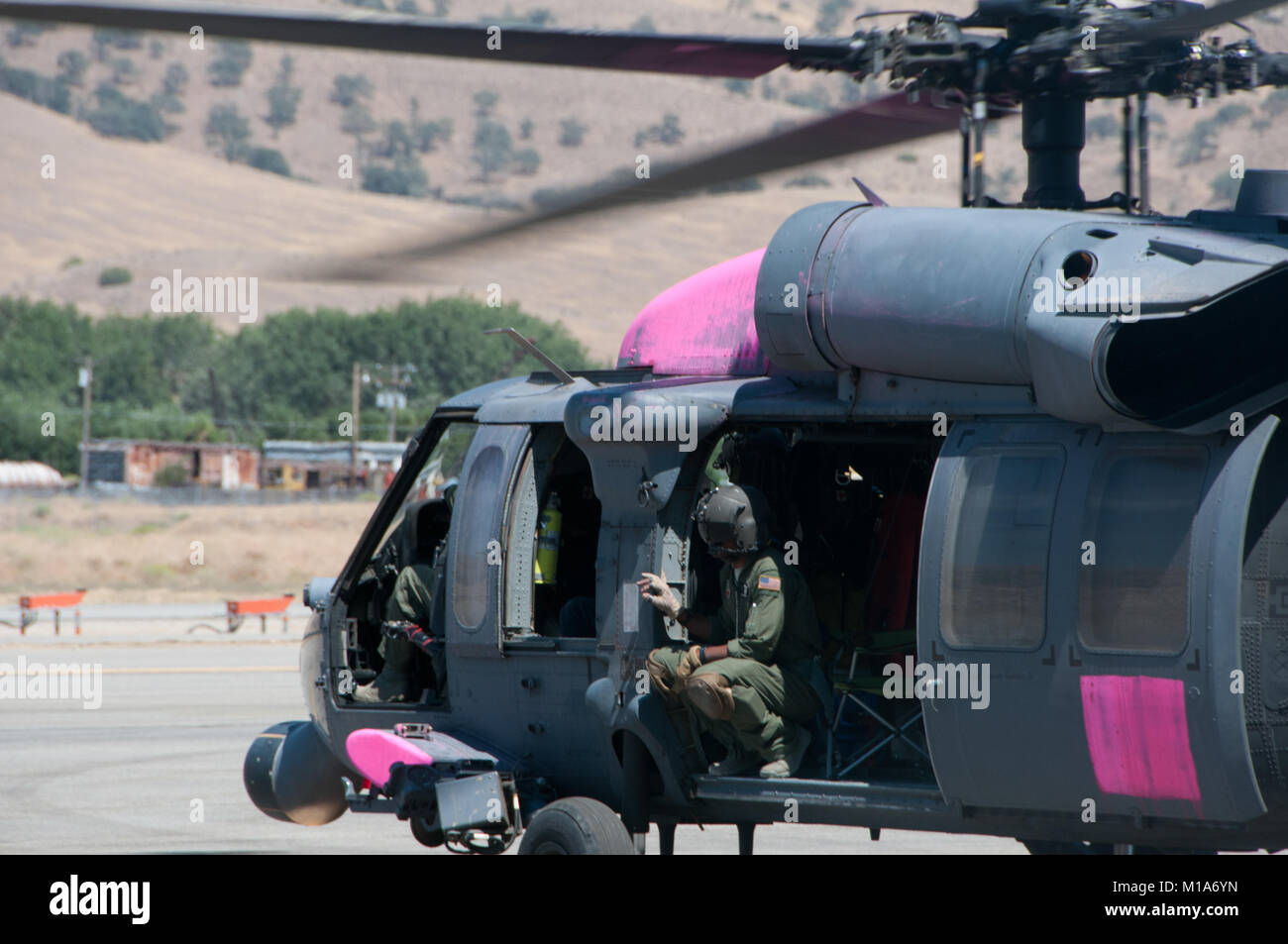 Joint Fire Fighting: Two HH-60G Pave Hawk helicopters from the 129th ...