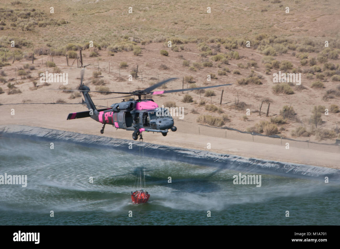 Joint Fire Fighting: Two HH-60G Pave Hawk helicopters from the 129th ...