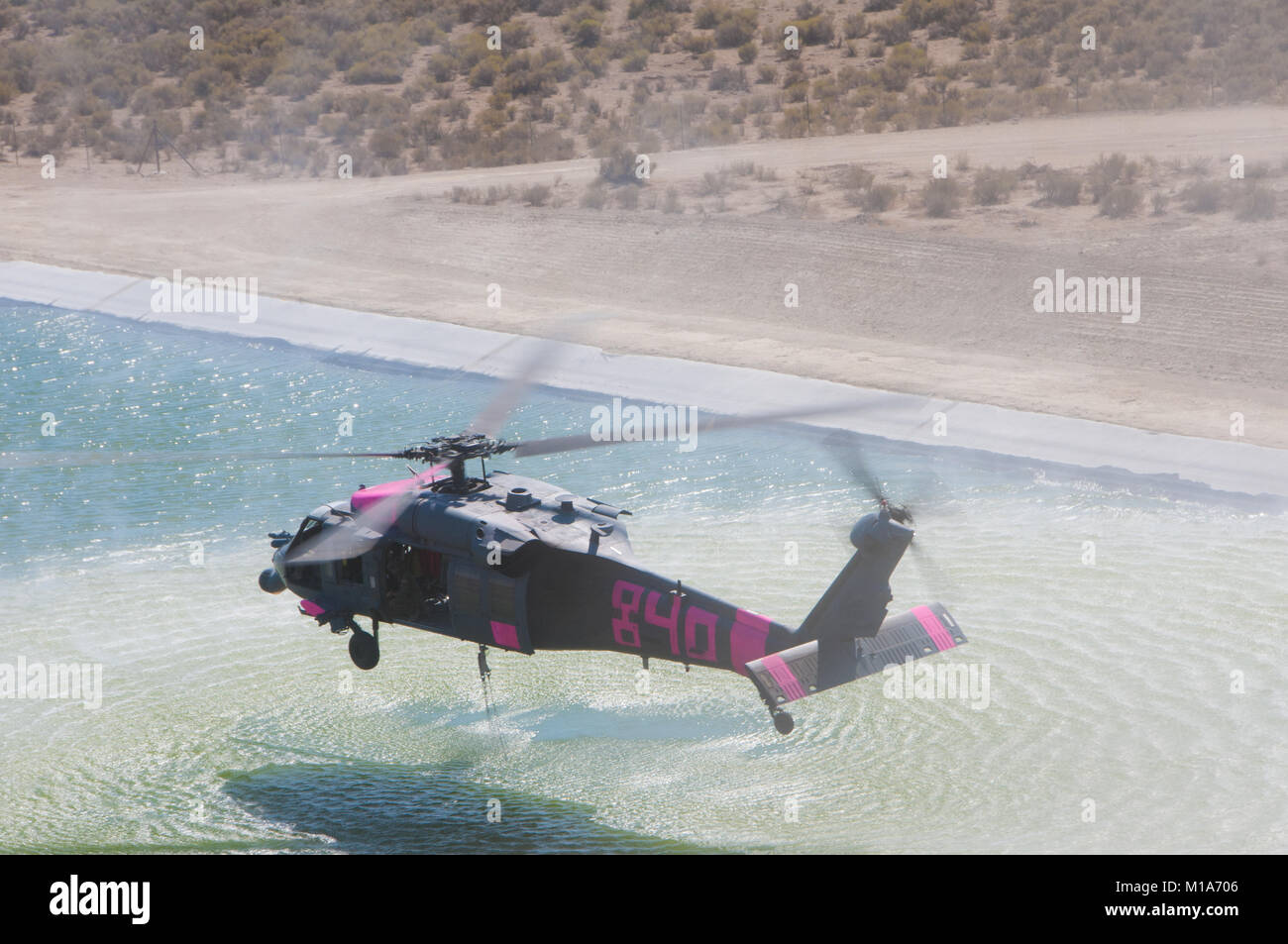 Joint Fire Fighting: Two HH-60G Pave Hawk helicopters from the 129th ...