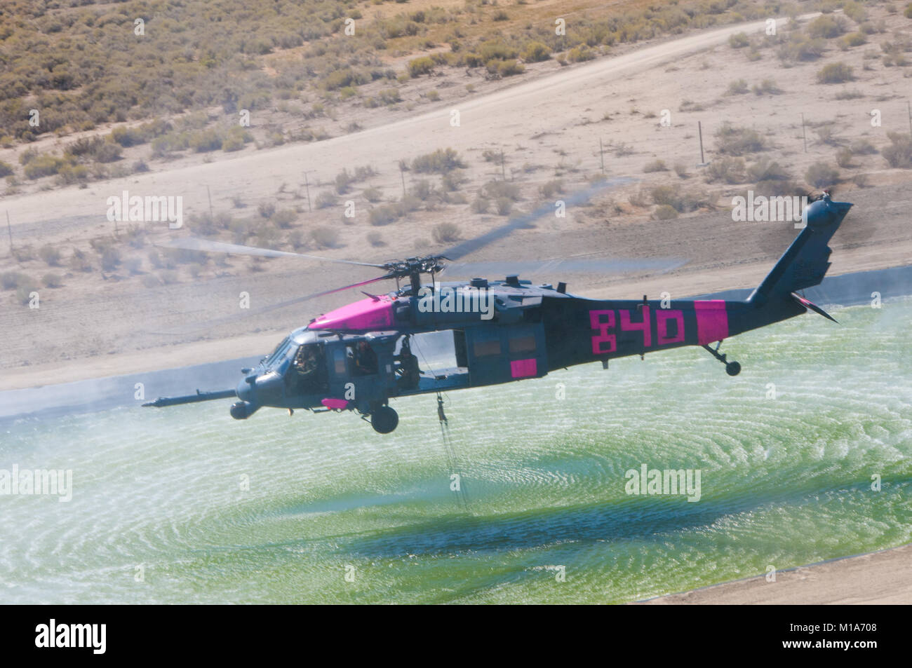 Joint Fire Fighting: Two HH-60G Pave Hawk helicopters from the 129th ...