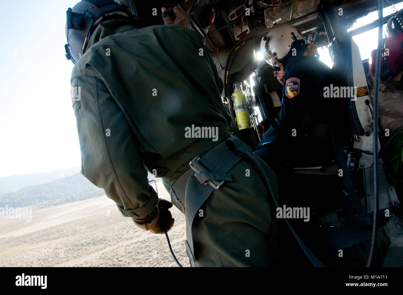 Joint Fire Fighting: Two HH-60G Pave Hawk helicopters from the 129th ...