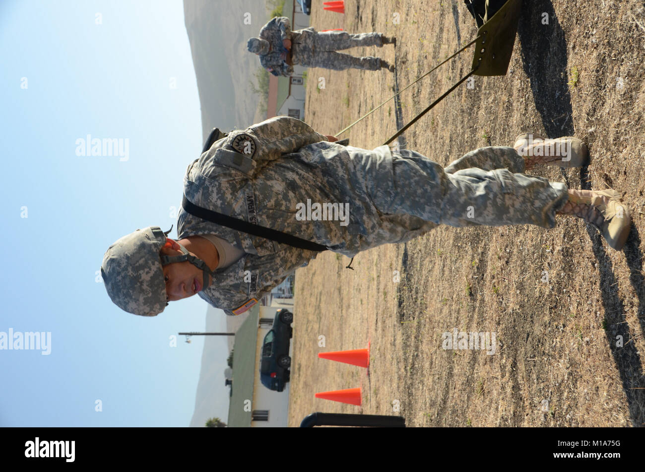 120910-Z-YY327-027 Spc. Brian Quinonez drags a 130-pound SKED litter ...
