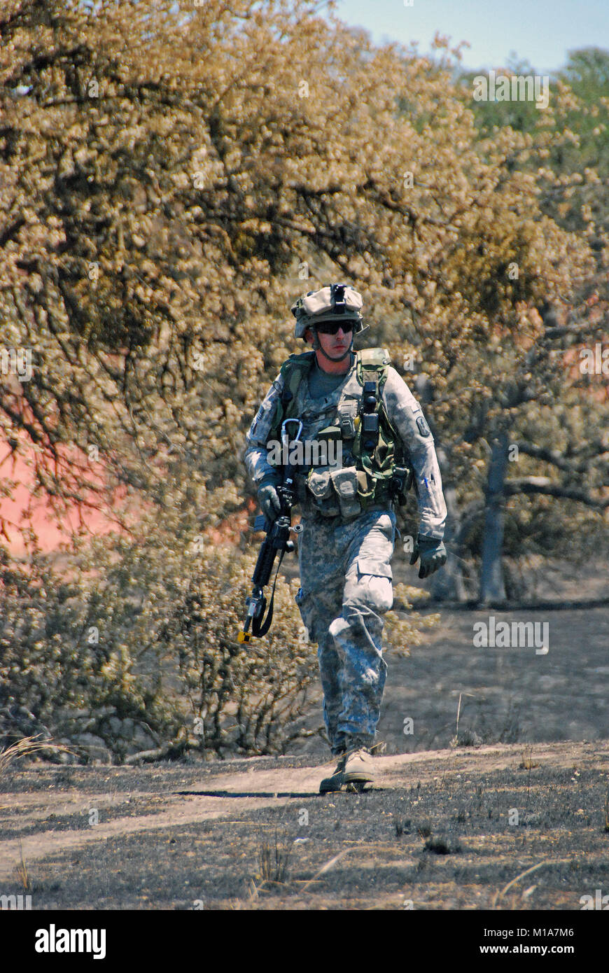 1st Lt. Bloom walks between guns to ensure proper security and setup ...
