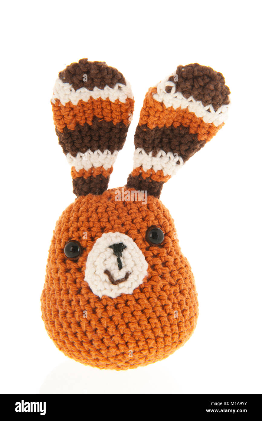 Handmade needle work stuffed animal puppet isolated over white ...
