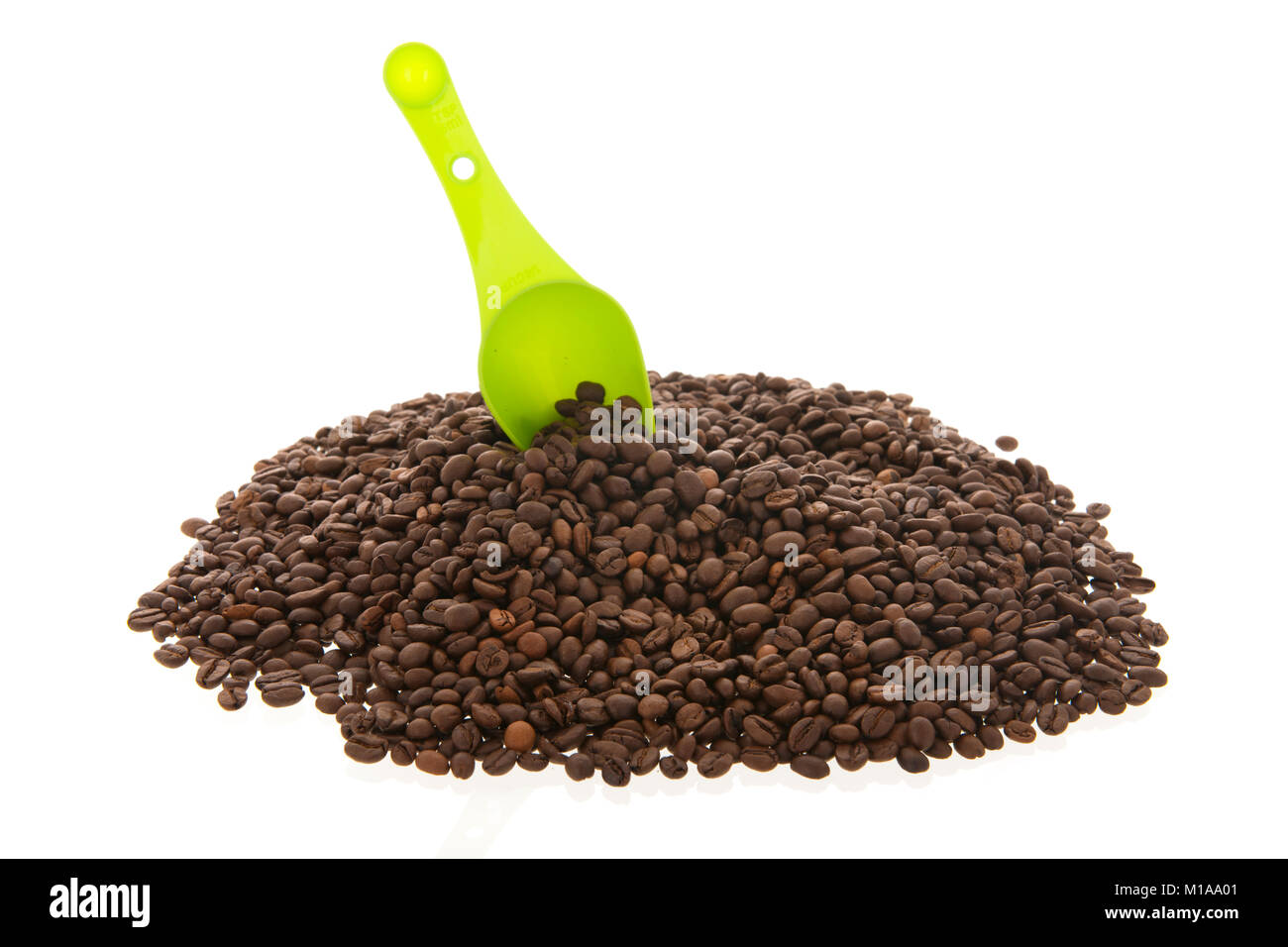 coffee beans with green spoon isolated over white background Stock ...