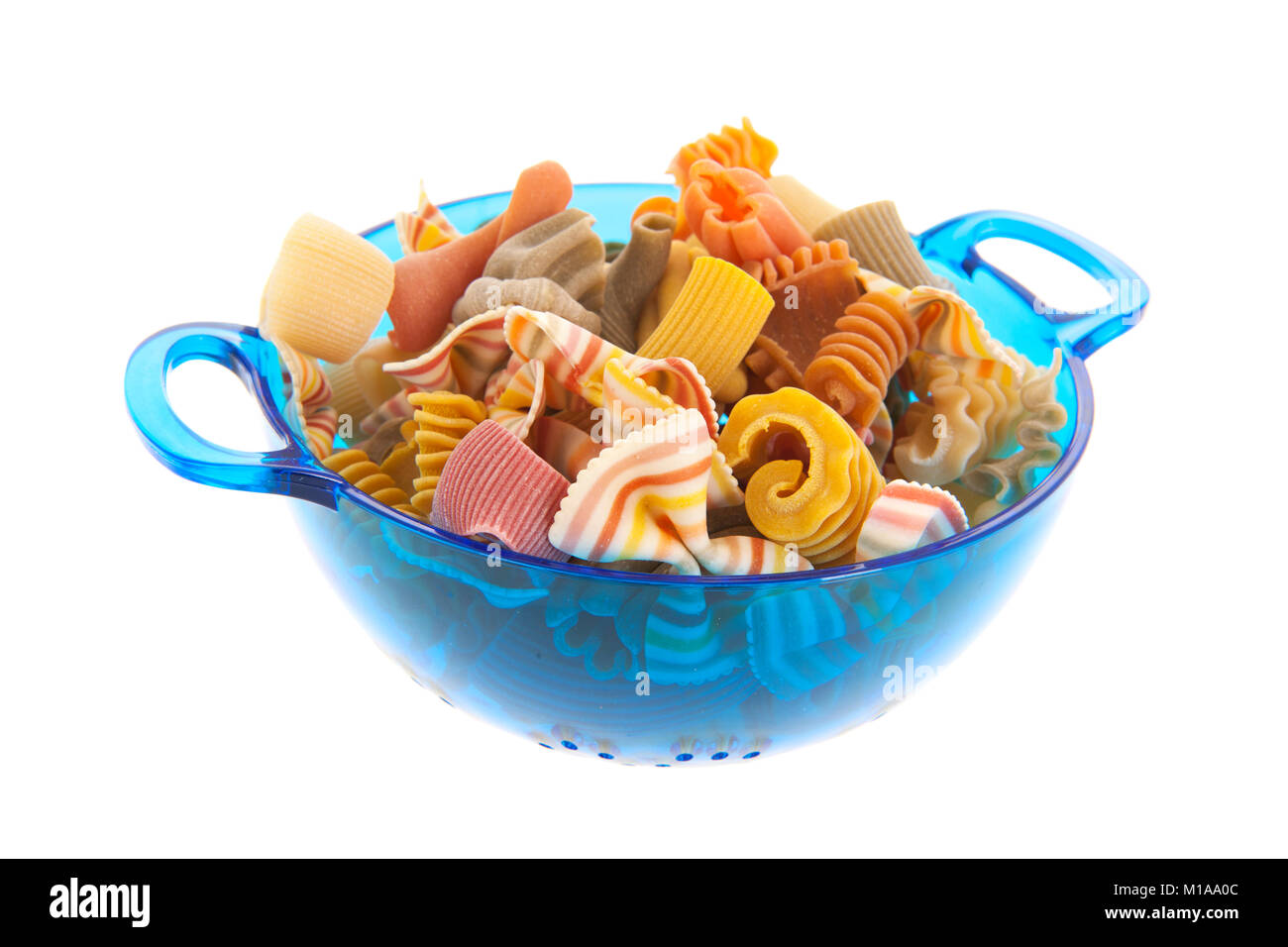 Mixed italian pasta in colander isolated over white background Stock ...