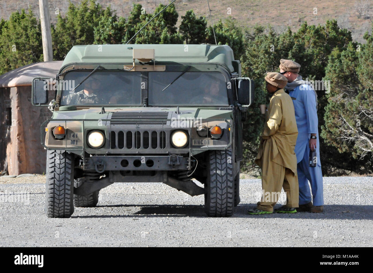 Human intelligence collectors talk to role players during an ...