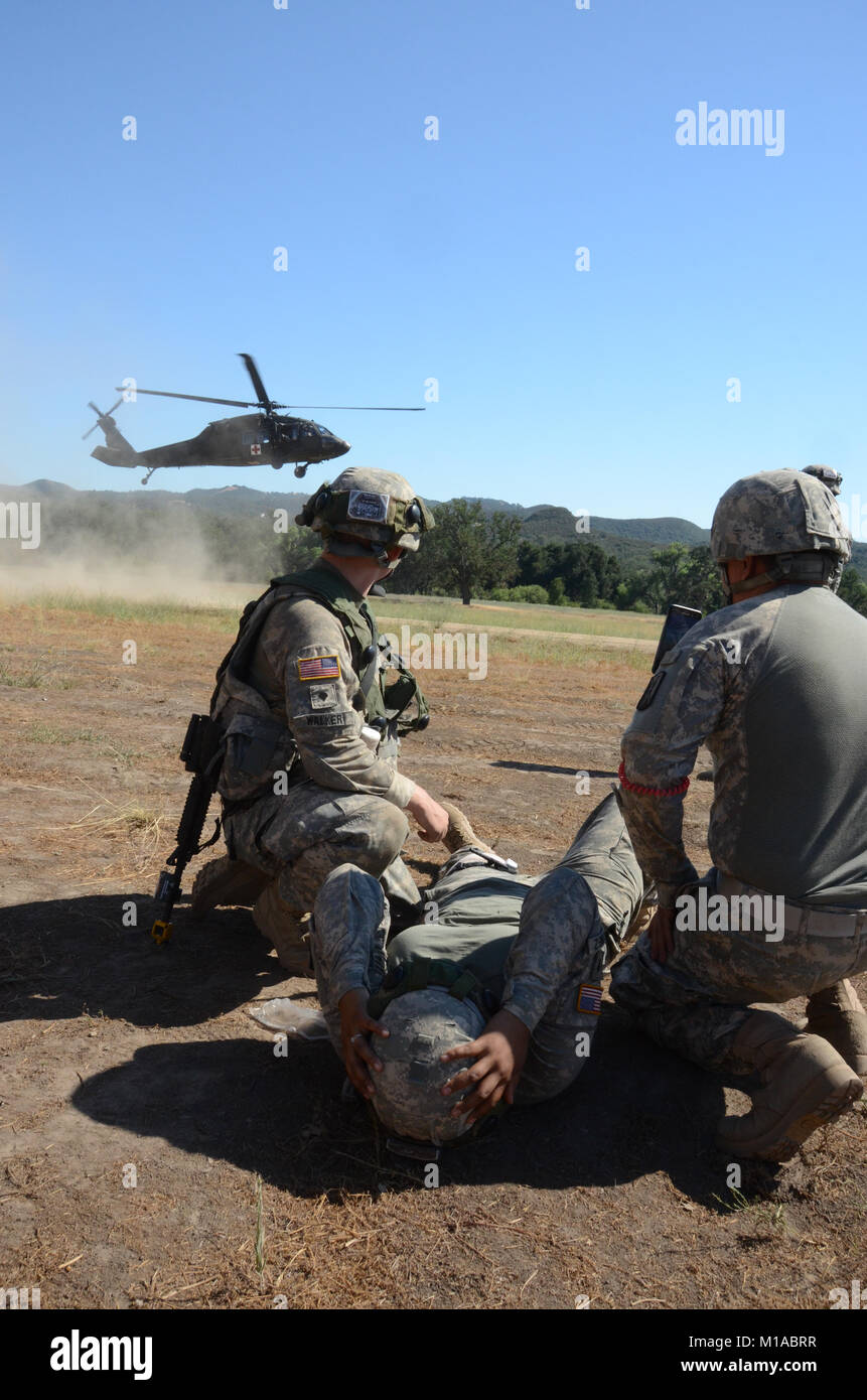 Spc. Taylor Walker, left, a field medic with Headquarters, 1st Squadron ...