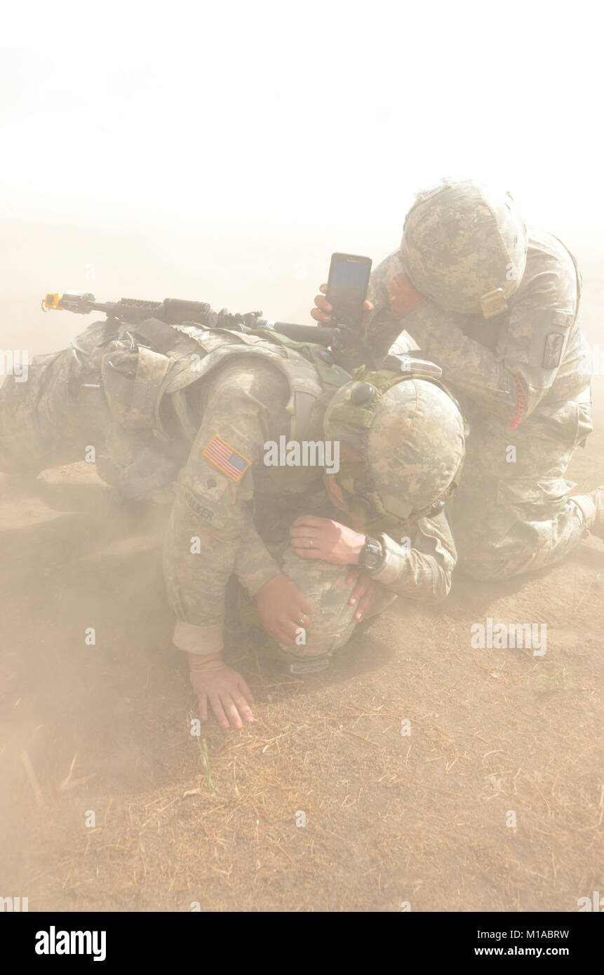 Spc. Taylor Walker, left, a field medic with Headquarters, 1st Squadron ...