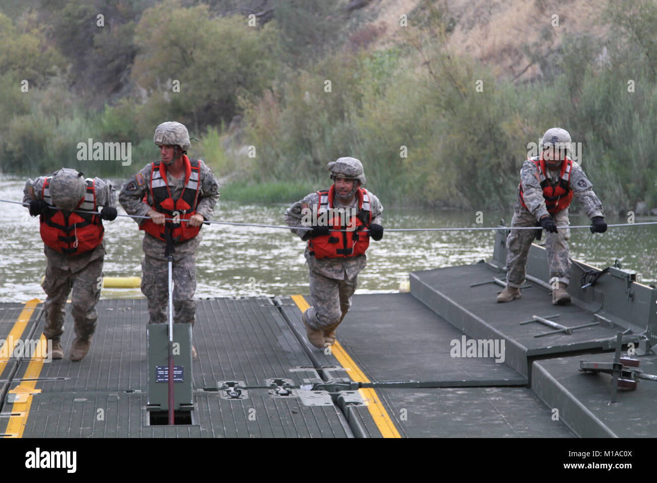 A launch and retrieve team from the 132nd Multirole Bridge Company ...