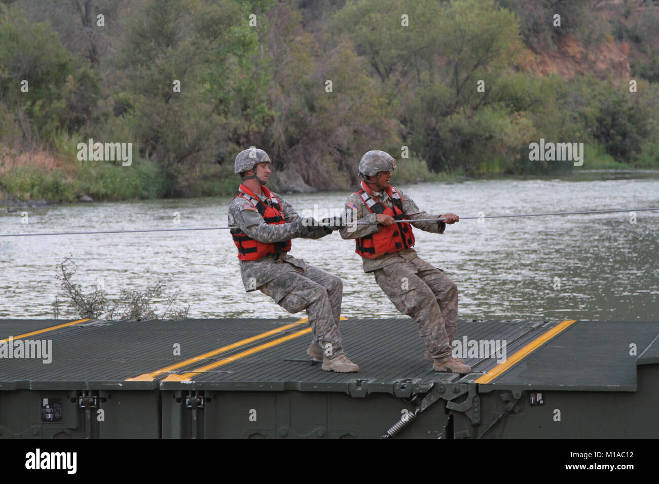 Members of the 132nd Multirole Bridge Company (MRBC), California Army ...