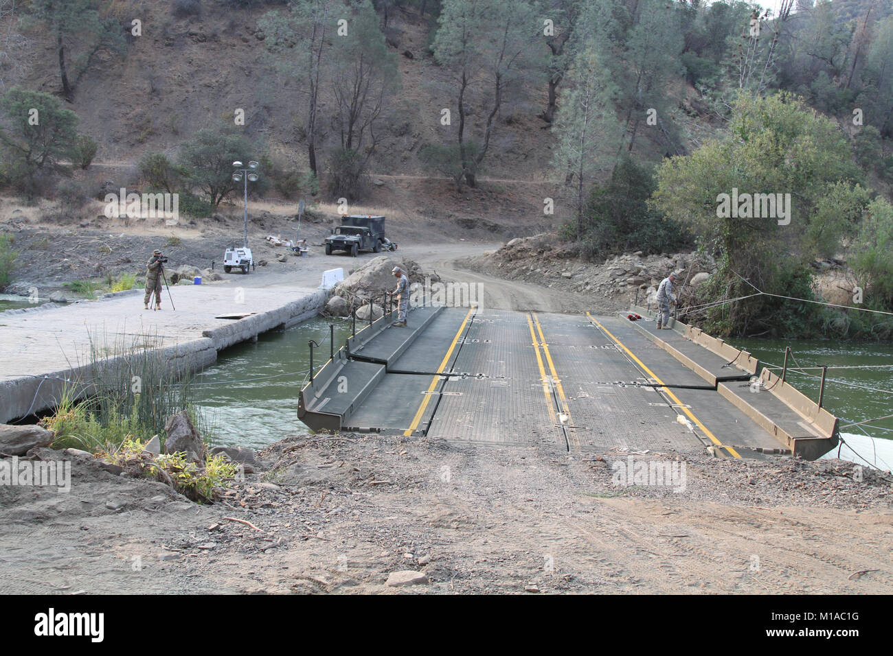Sgt. 1st Class Ben Nievera, center, noncommissioned officer in charge ...