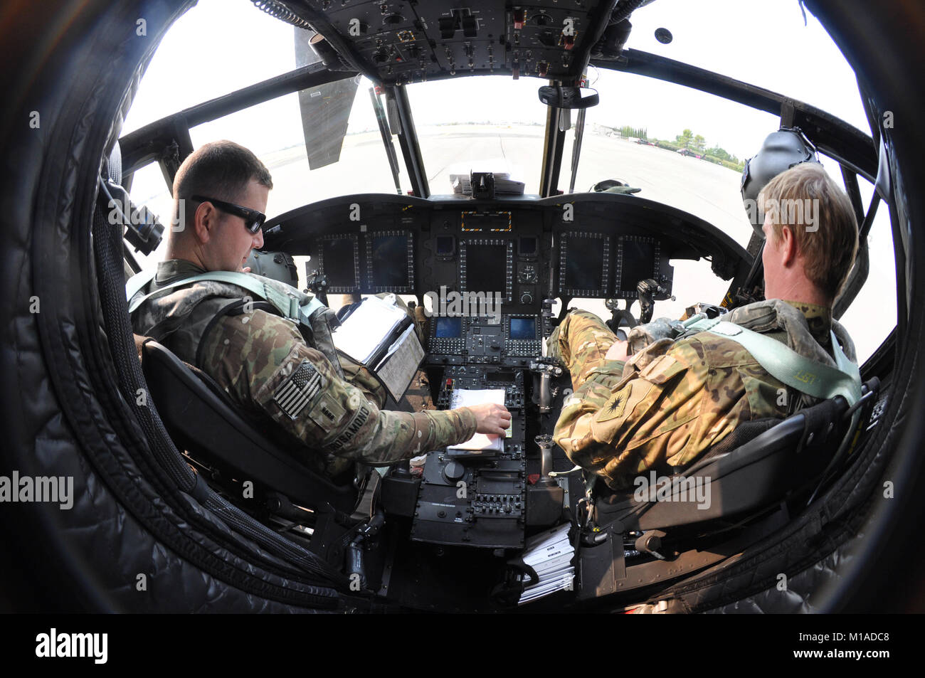 Chief Warrant Officer 4 Joe Rosamond, left, pilot in command, and Chief ...