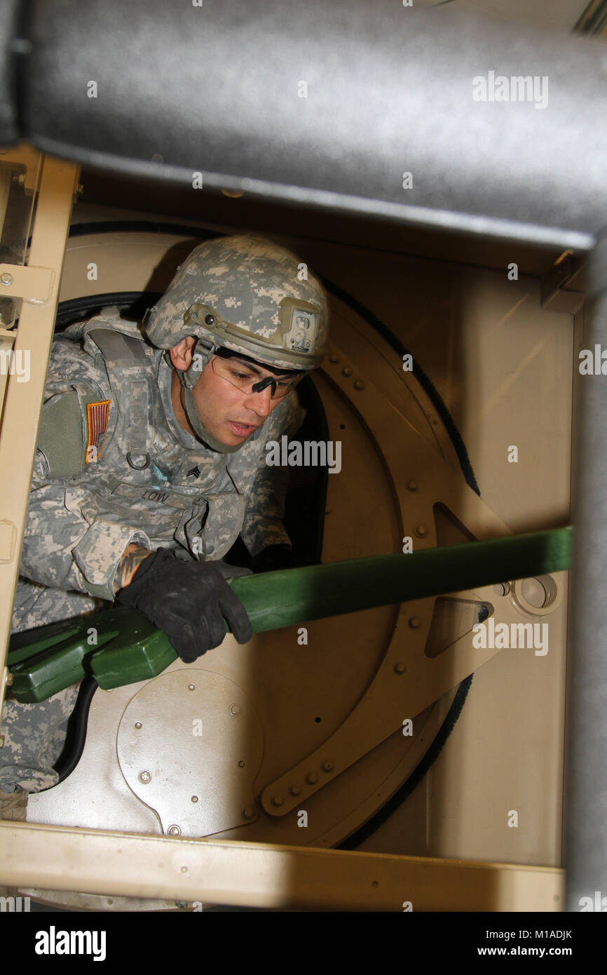 Sgt. Sheridan Low, 235th Engineer Company, exits a Humvee simulator ...