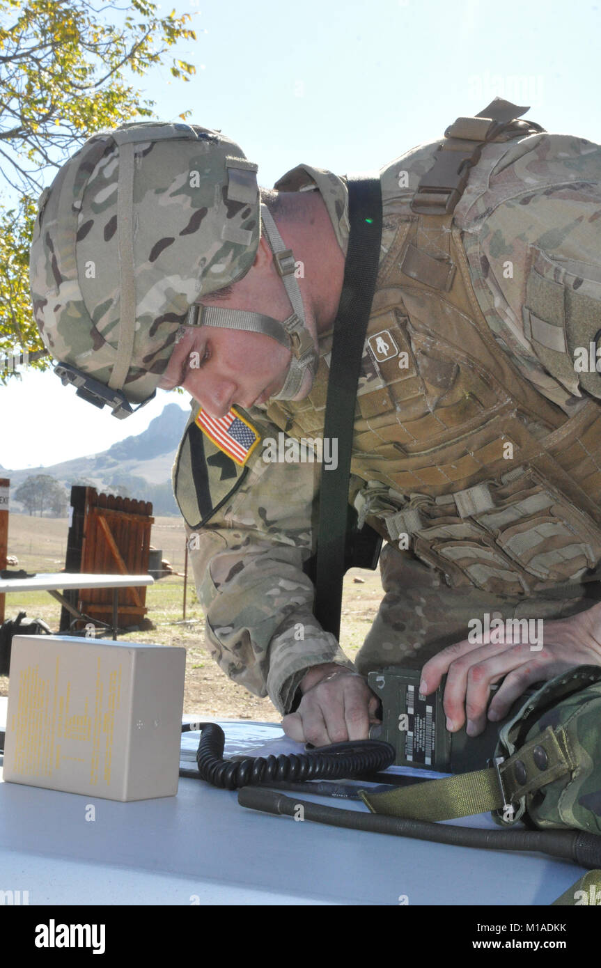 Sgt. John Rotner, 1st Battalion, 18th Cavalry Regiment, attaches a ...