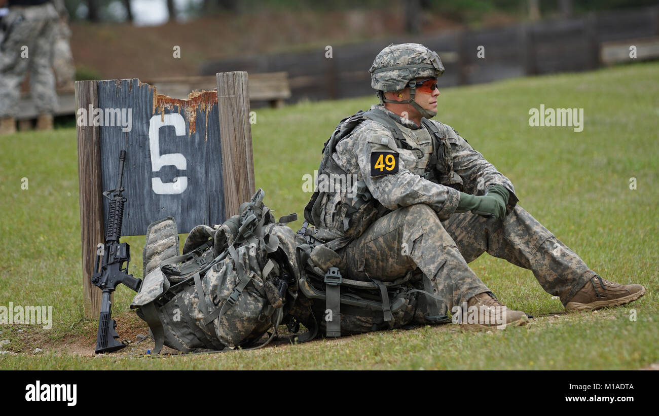 U.S. Army Sgt. 1st Class Jonathan Knea waits for his teamate to finish ...