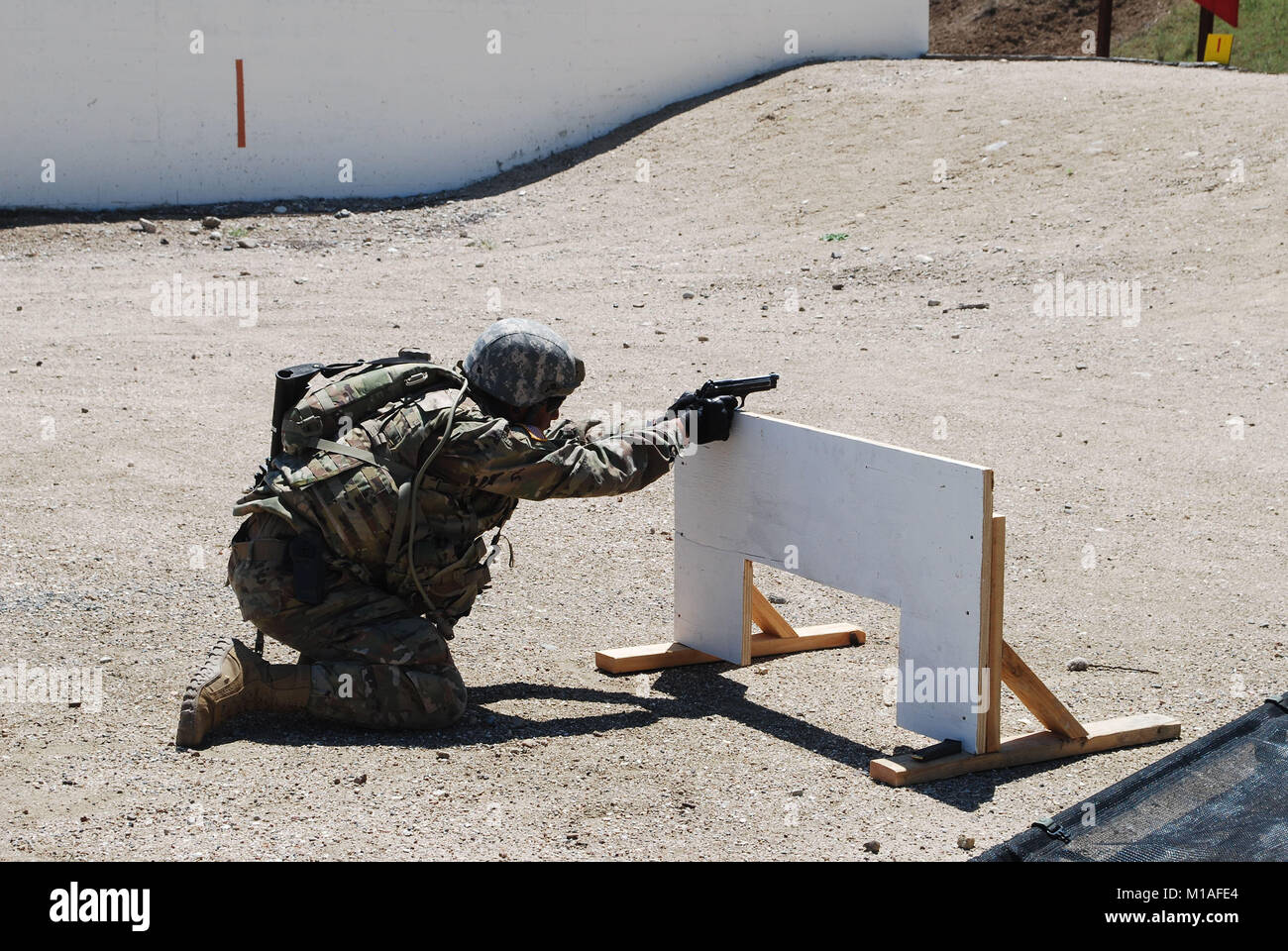 Pvt. Carlo Octoman, from the 330th MP Company, fires his weapon on the ...
