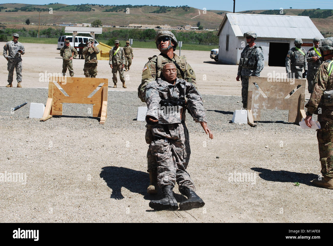Pvt. Carlo Octoman, from the 330th MP Company, carries a dummy to the ...