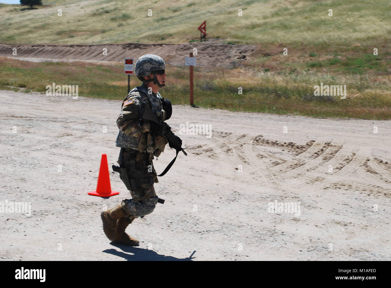Pfc. Lucas Myers, from FSC, 579th Engineer Battalion, runs 500 meters ...