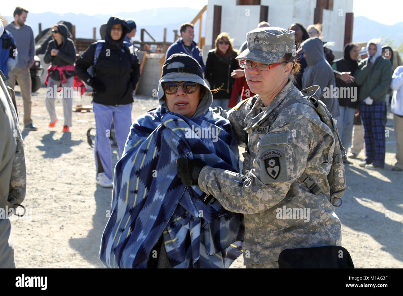 Sgt. Susan Mead with the 149th Chemical Company helps an injured victim ...