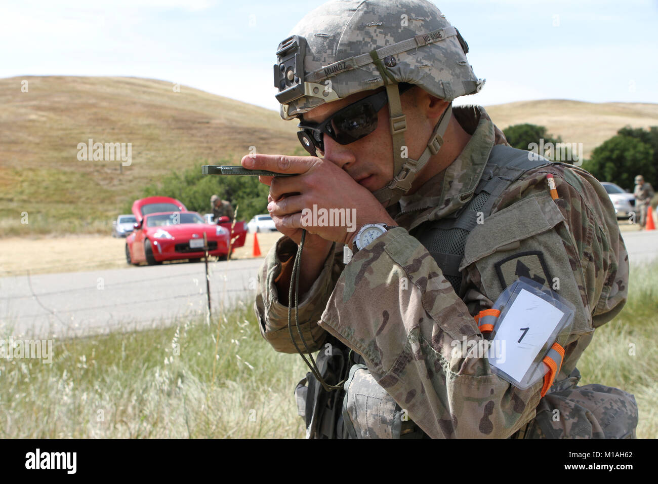 Arizona Army National Guardsman Spc. Stephen Munoz shoots an azimuth ...