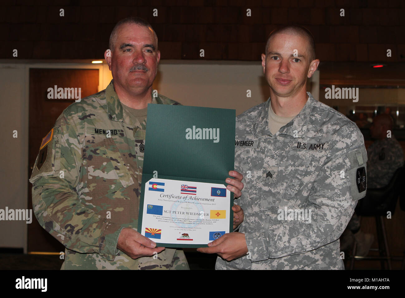 Sgt. Peter R. Wiedmeier, right, of the Utah Army National Guard accepts ...
