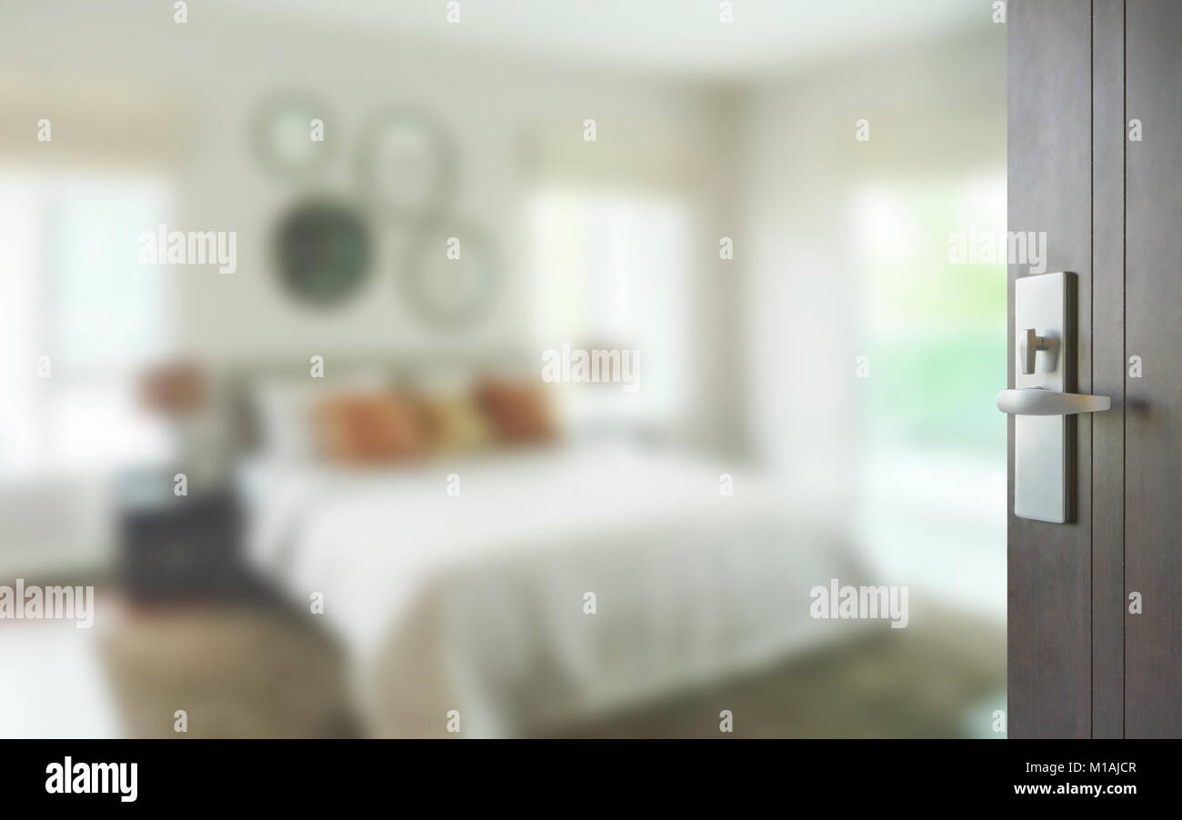 opened wooden door to modern bedroom interior Stock Photo - Alamy