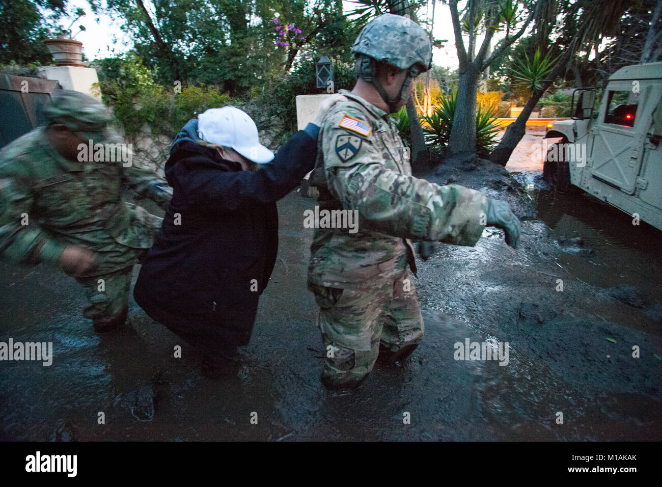 Soldier rescuing woman hi-res stock photography and images - Alamy