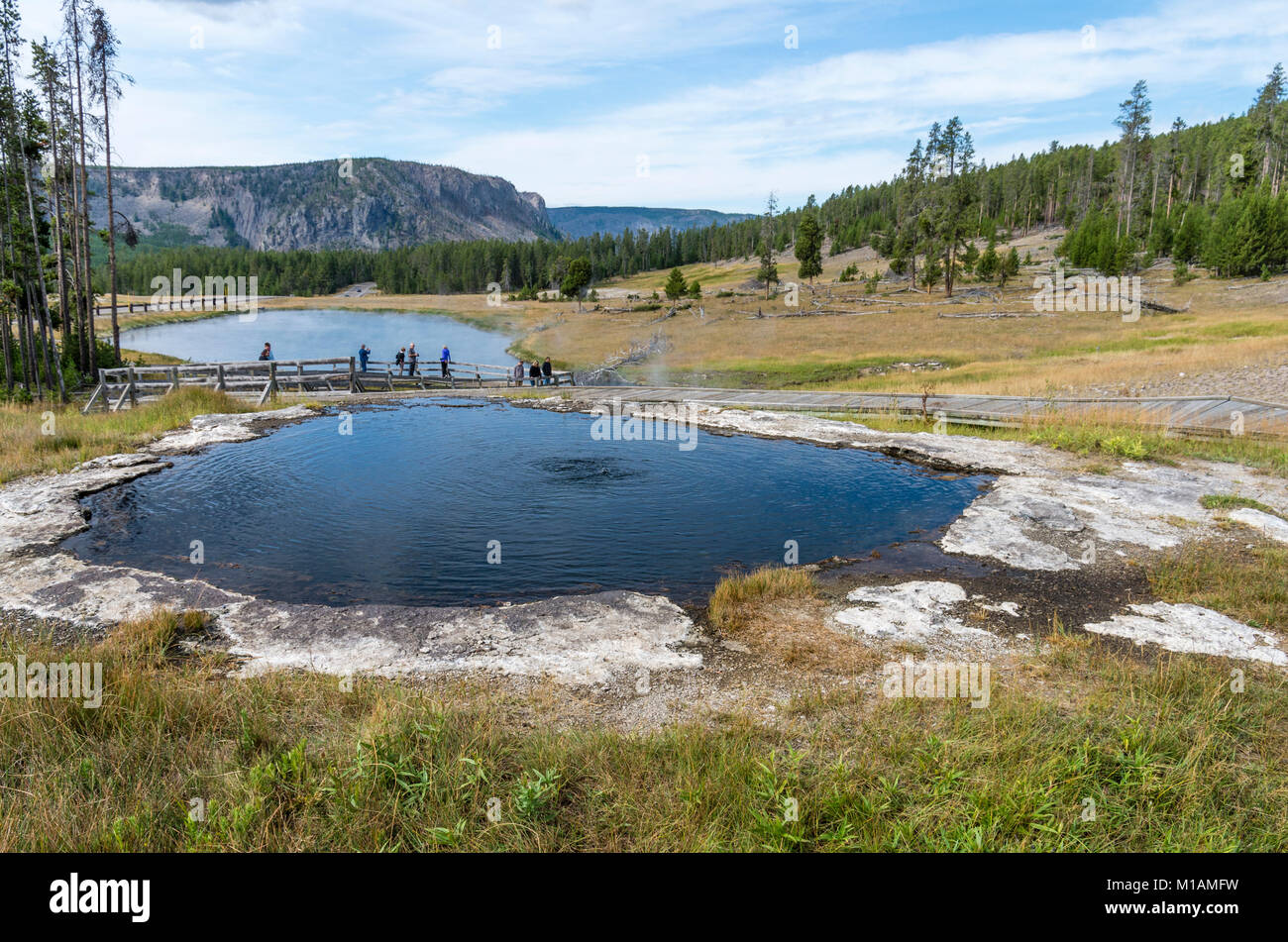 Tourists visiting the Terrace Springs thermal feature. Yellowstone ...