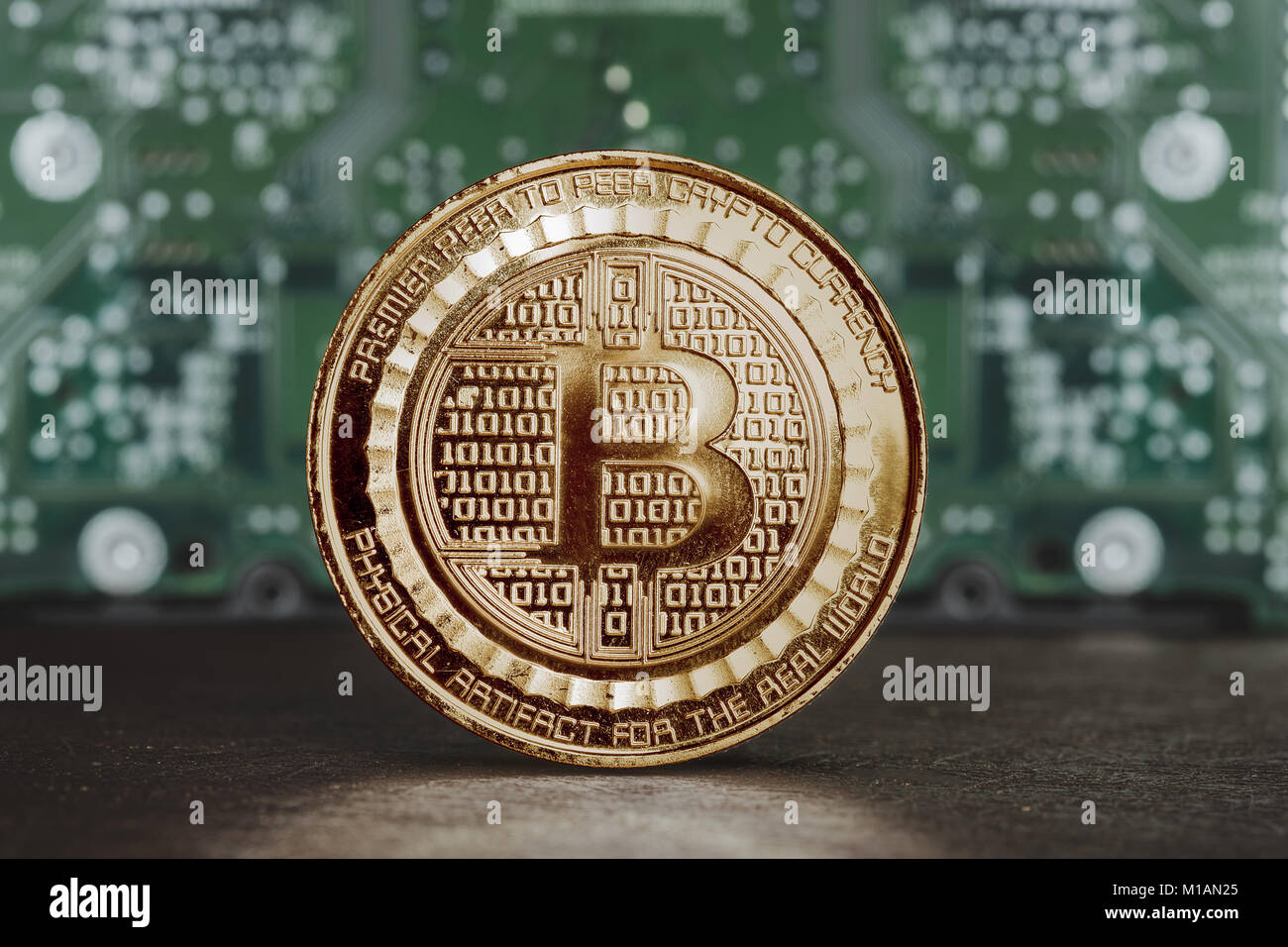 Gold metallic Bitcoins at electronic circuit motherboard.crypto currency mining.Digital money on ...
