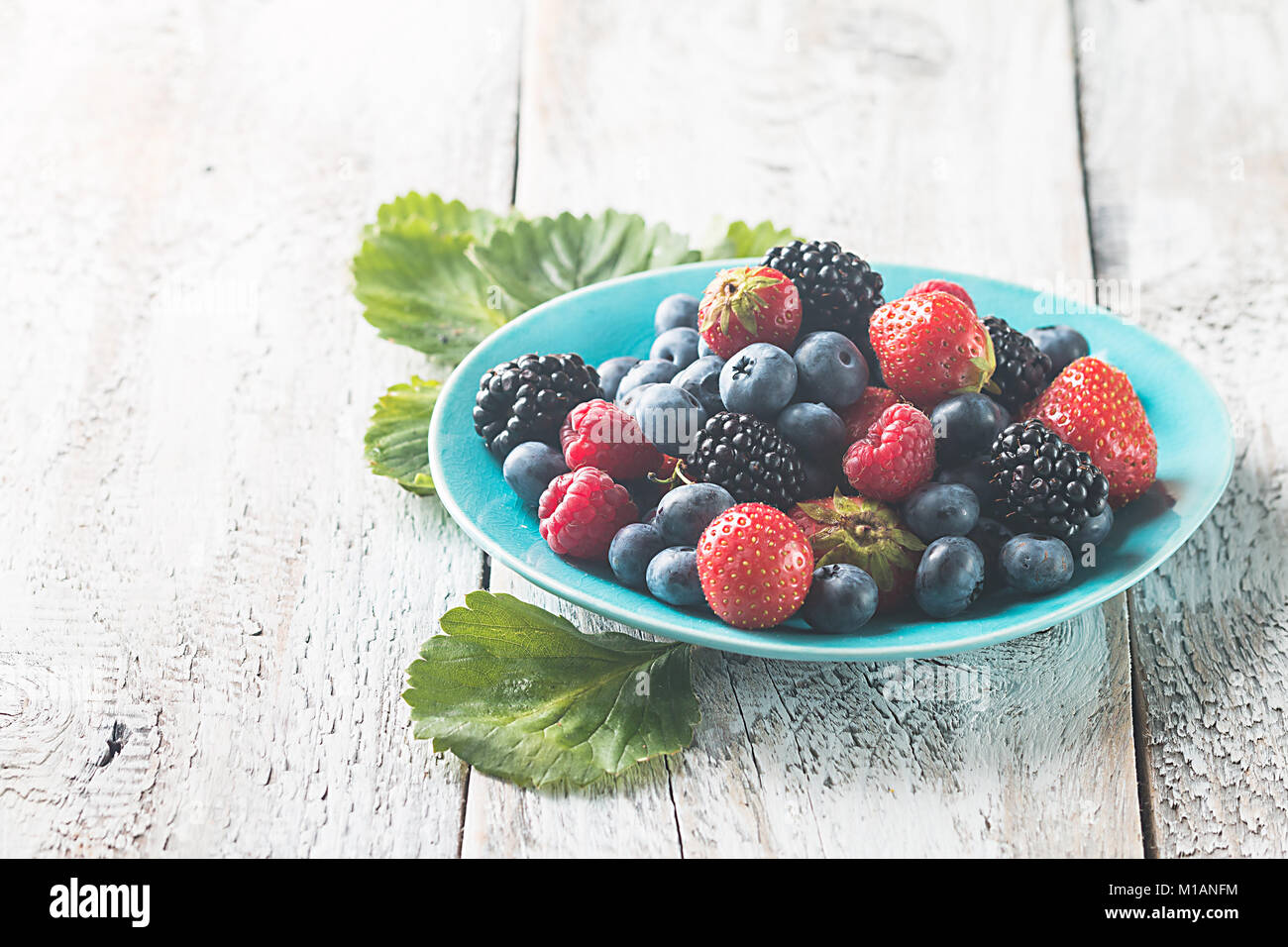 different berries in bowl Stock Photo - Alamy