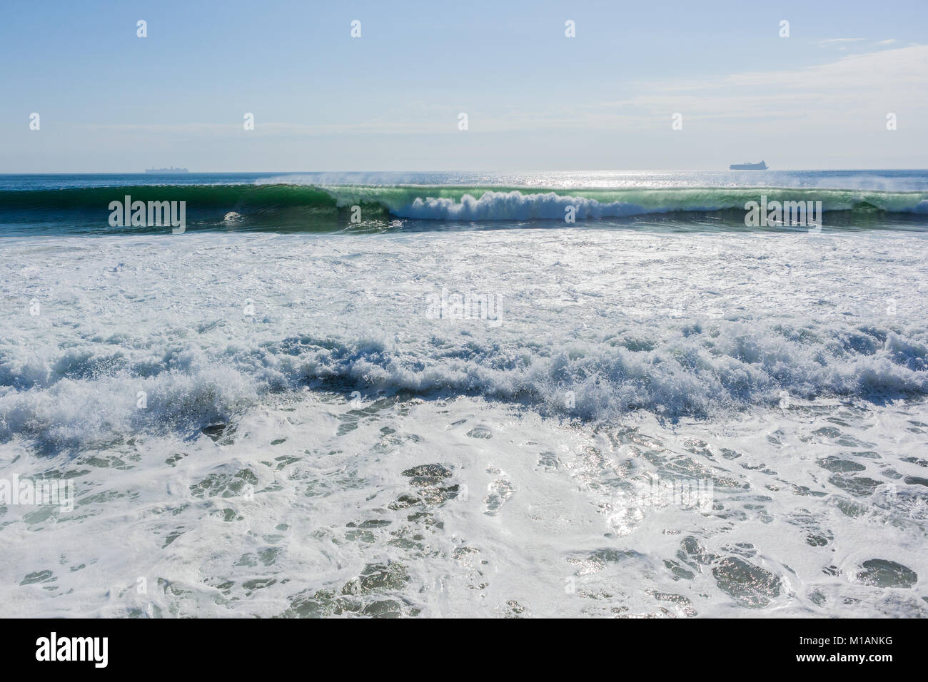 Ocean wave large summer swells with merchant ships on horizon Stock ...