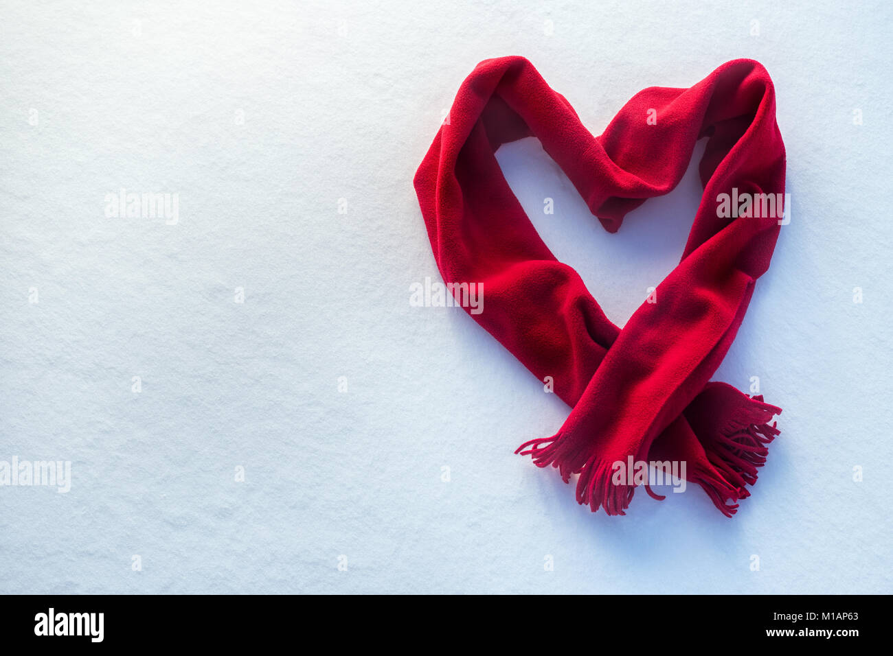 Heart on snow hi-res stock photography and images - Alamy