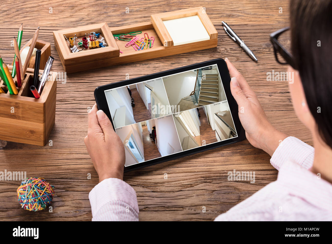Close-up Of A Businesswoman Monitoring The CCTV Footage Of Office On ...
