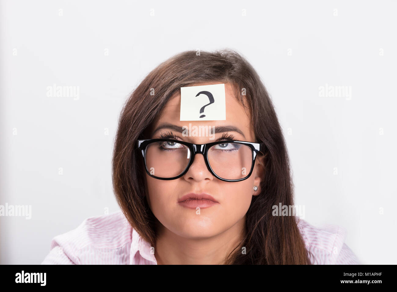 Woman Looking Up Over The Sticky Note With Question Mark On Her ...