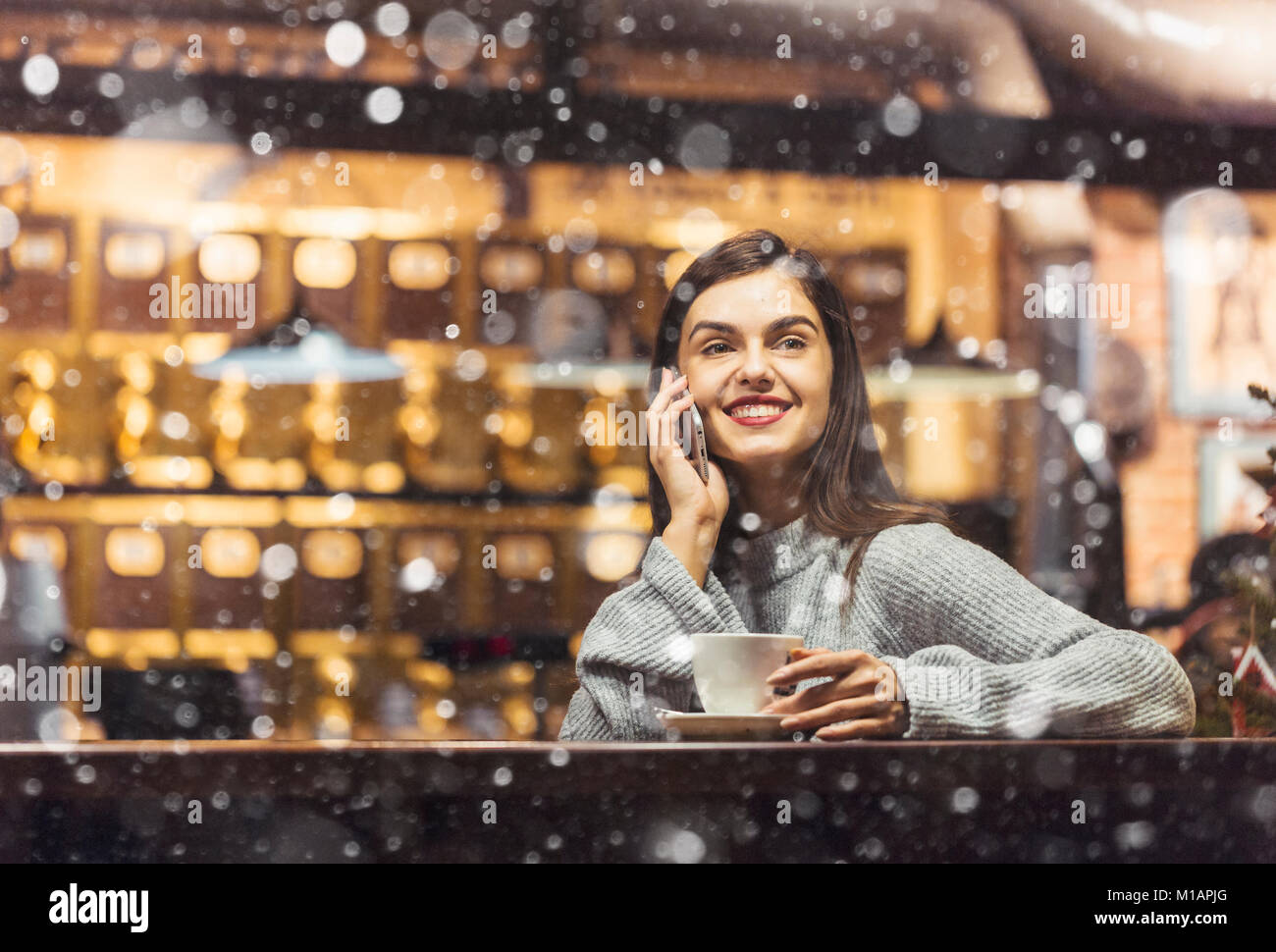 Girl Talking by Phone in Cafe Stock Photo - Alamy