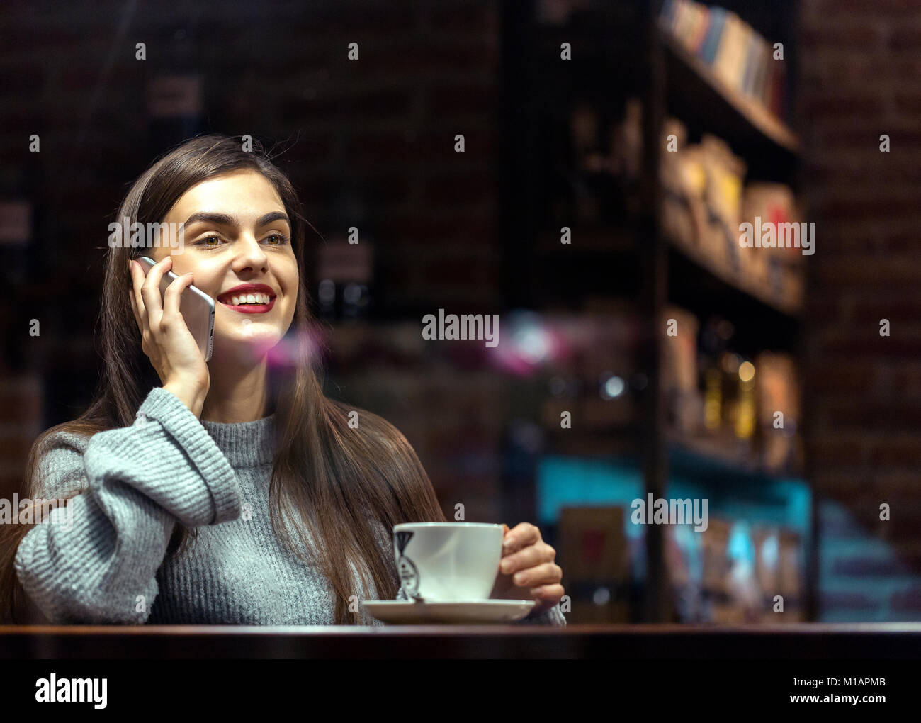 Girl Talking by Phone in Cafe Stock Photo - Alamy